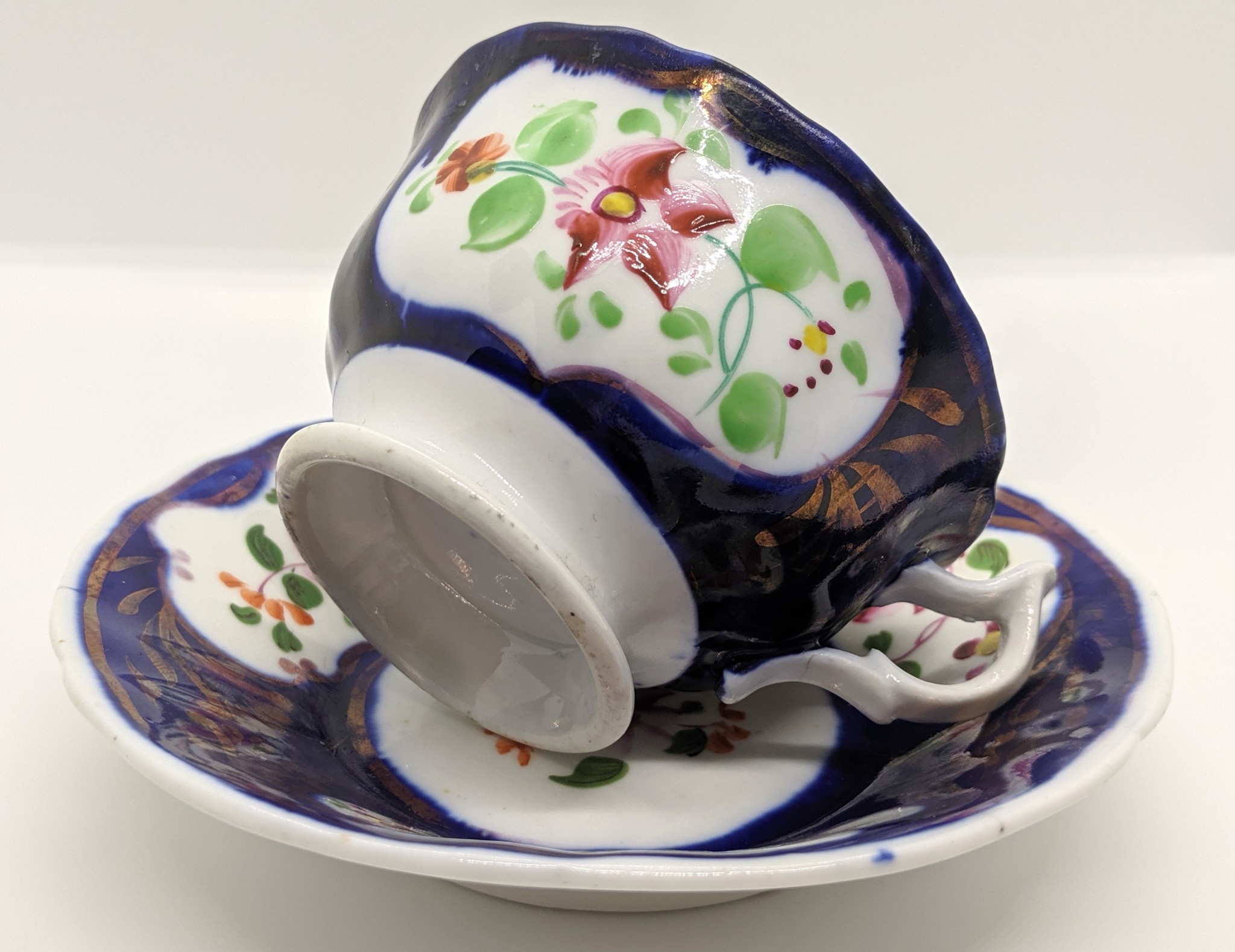 Gaudy Welsh 'columbine' teacup and saucer c 1835